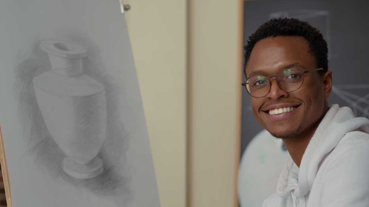 Portrait of young student learning to draw sketch model on canvas ...