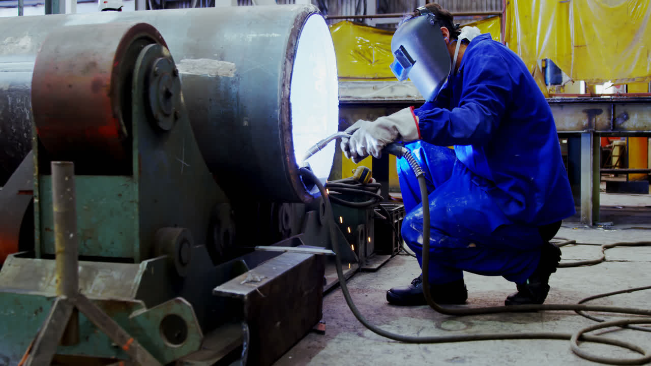 Male engineer using welding torch 4k | Premium Stock Video Footage
