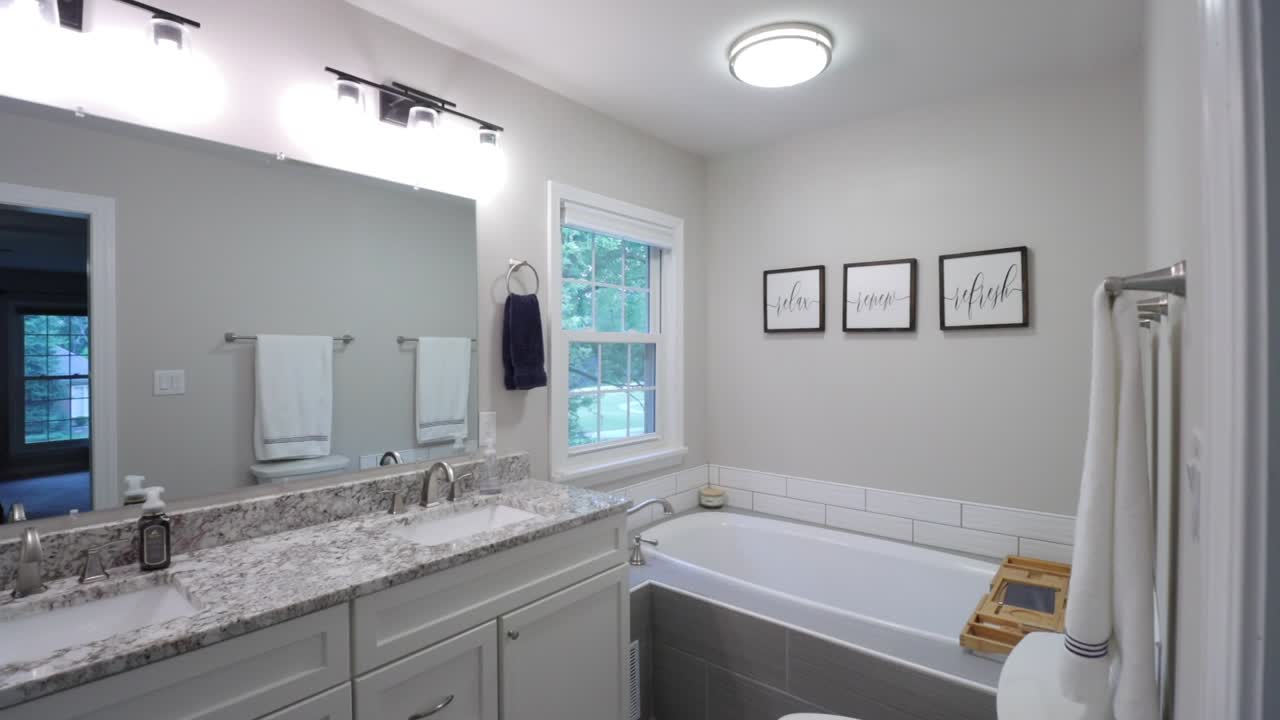 Premium stock video - Gimbal footage pushing into the master bathroom ...