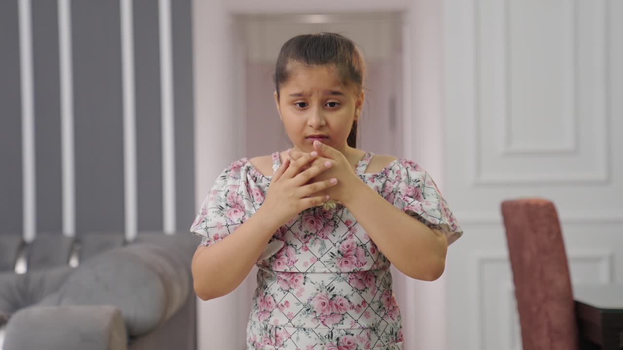 Premium stock video - Frightened indian kid girl getting anxious and scared