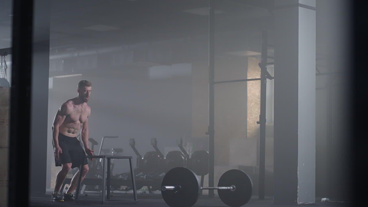 Premium stock video - Athlete gave exercise. jumping on the box. strong ...