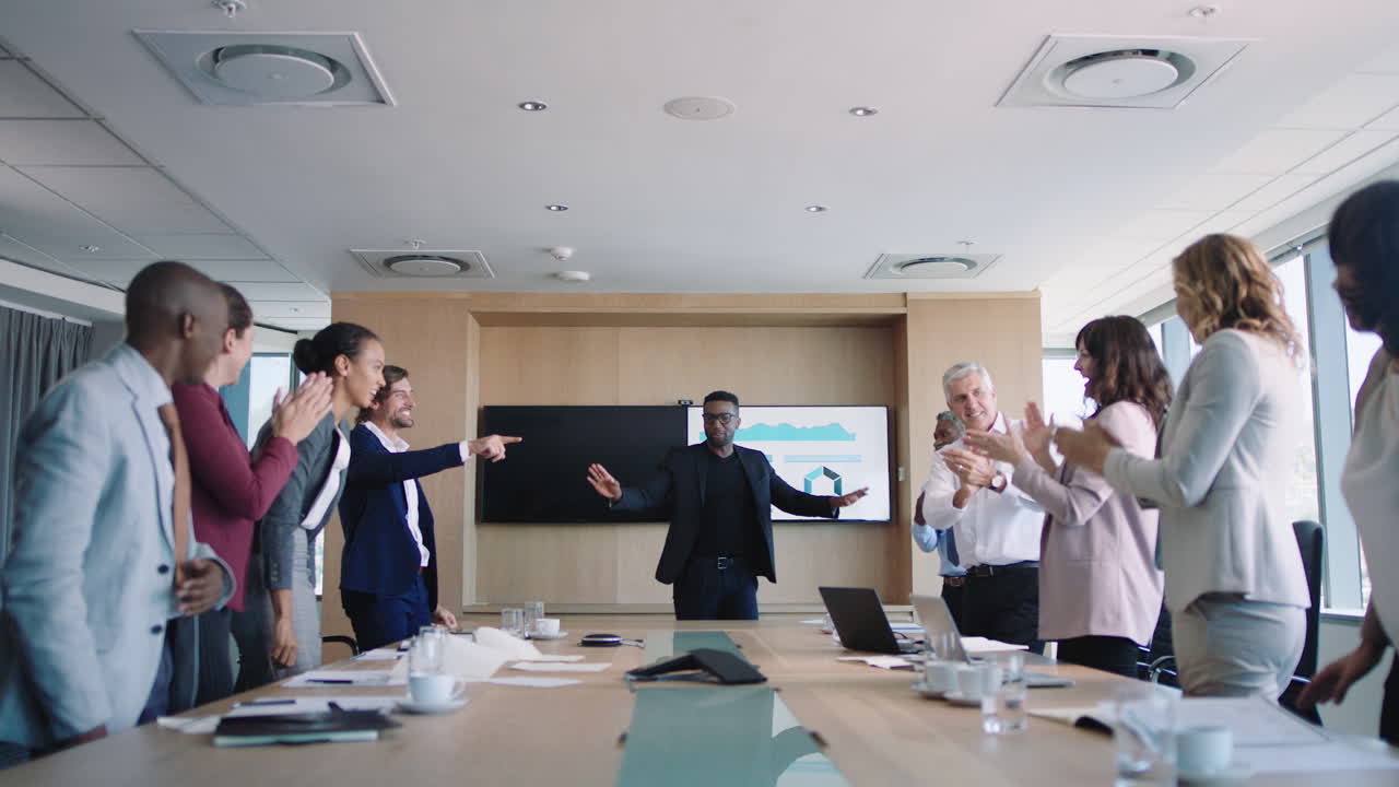 Happy business people clapping hands in boardroom successful corporate ...