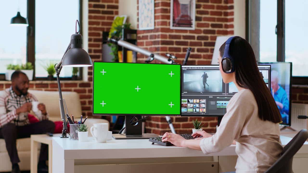 Premium stock video - Female video editor working on a creative project ...