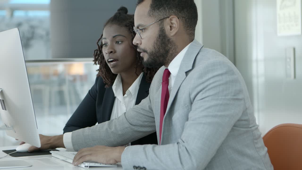 Premium stock video - Business people using desktop computer