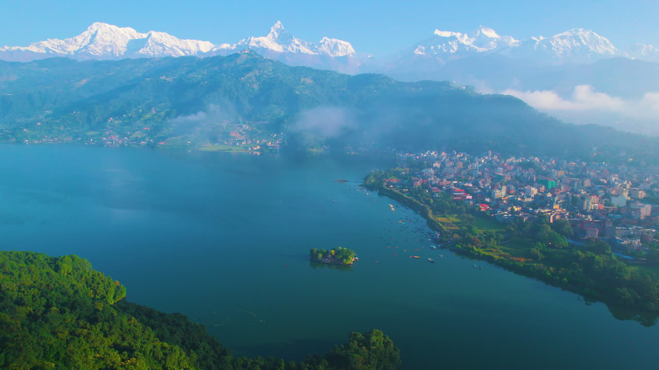 Drone shot captures the stunning pokhara valley gliding through a lush ...