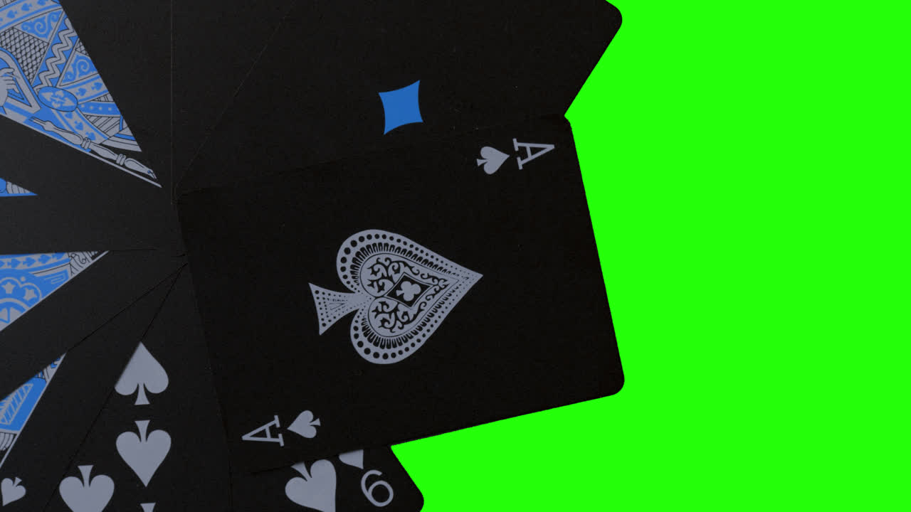 Birdeye rotating shot of black stylish casino poker cards with blue ...