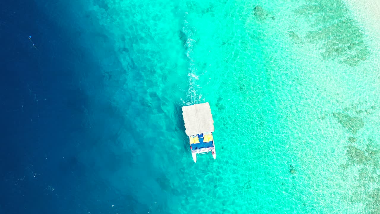 Premium stock video - Small boat sailing near the coral reef malaysia ...