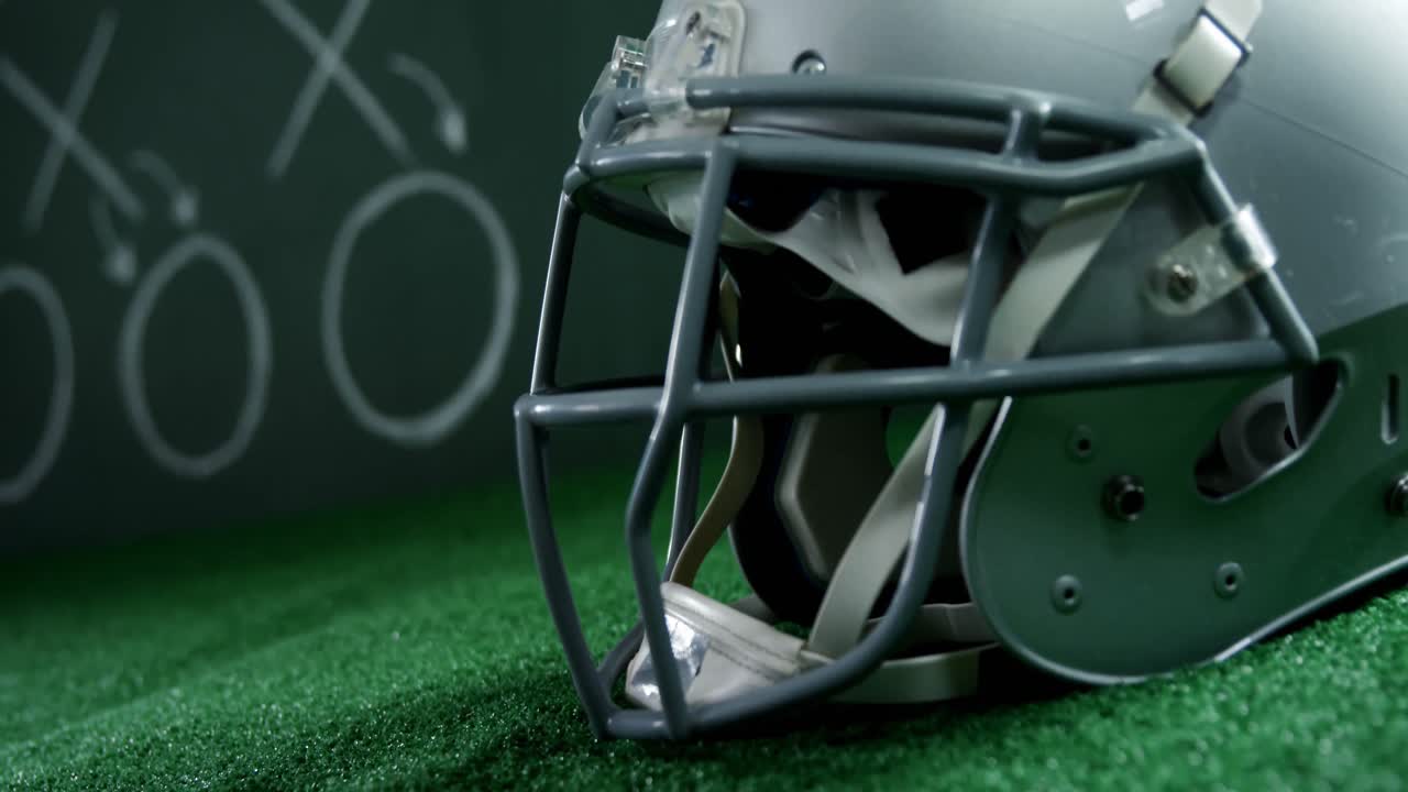Premium stock video - Head gear on artificial turf 4k