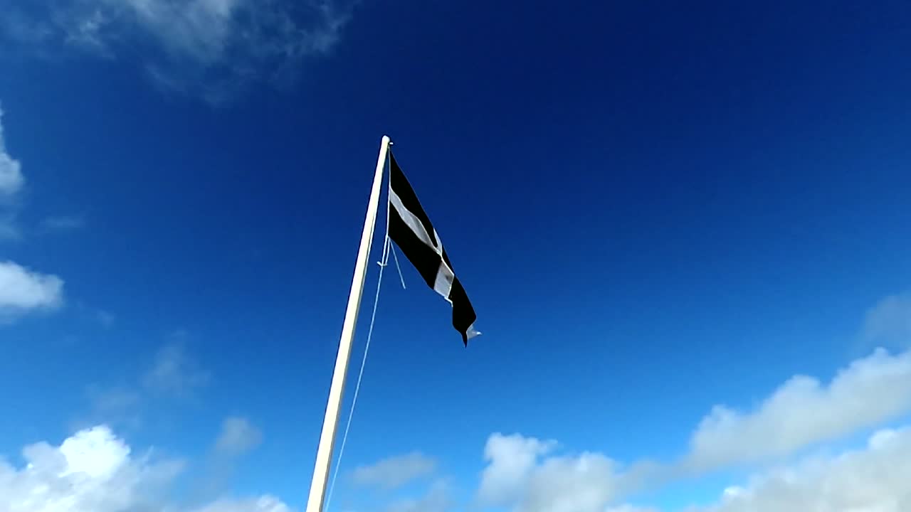 Cornish Flag Flying High Against A Blue Sky Free Stock Video Footage ...