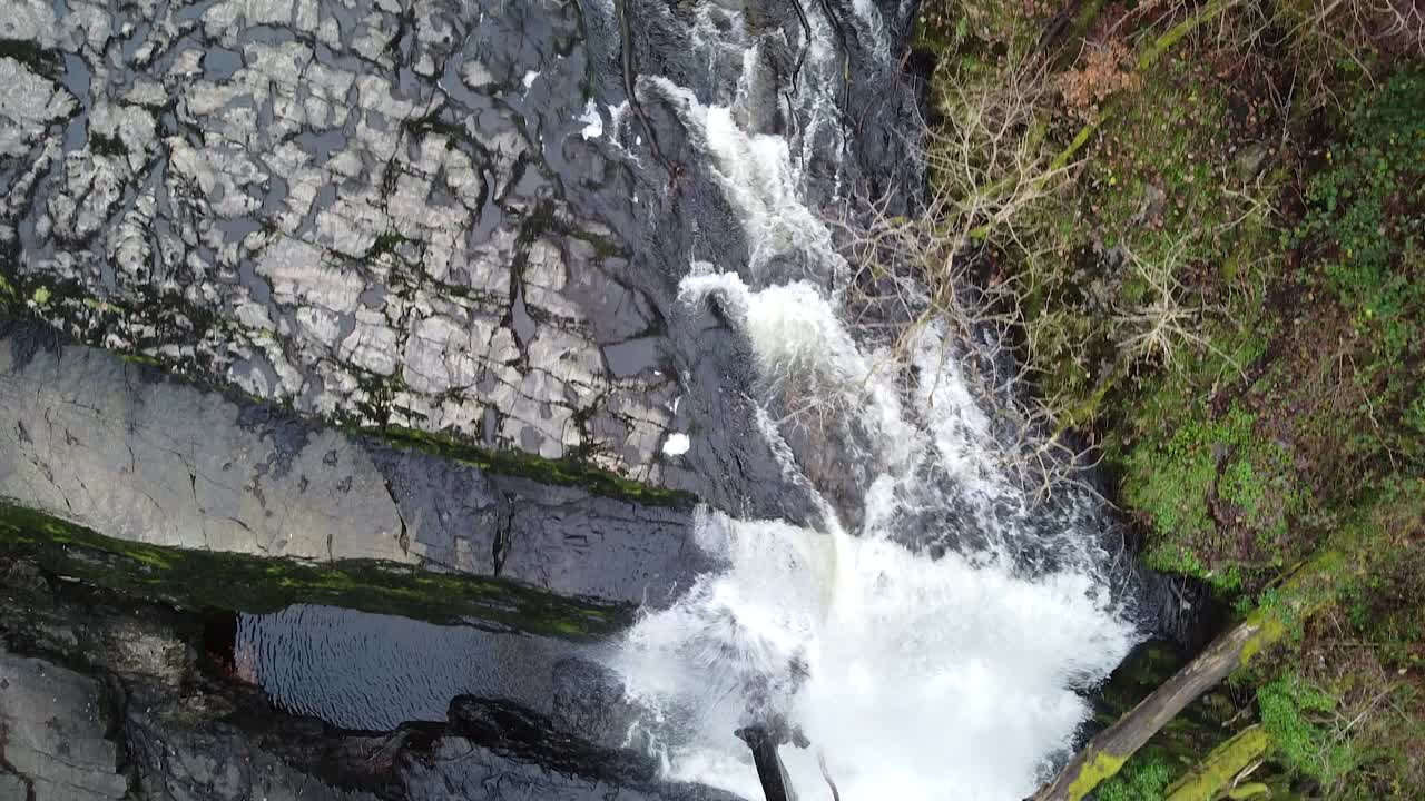 Premium stock video - A top-down shot of a waterfall, tracking the ...