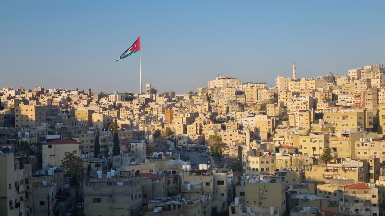 Stunning sunset view over Amman, Jordan, with warm light illuminating ...