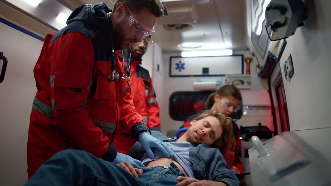 Free stock video - Emergency care assistant providing medical help to ...