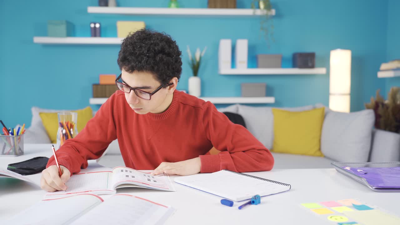 Premium stock video - A child who cannot focus on his studies stops ...