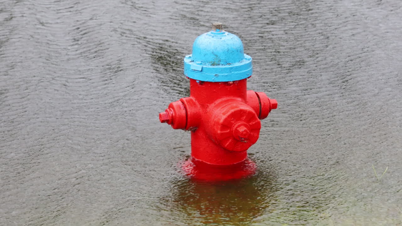 Fire hydrant underwater from flooding | Premium Stock Video Footage