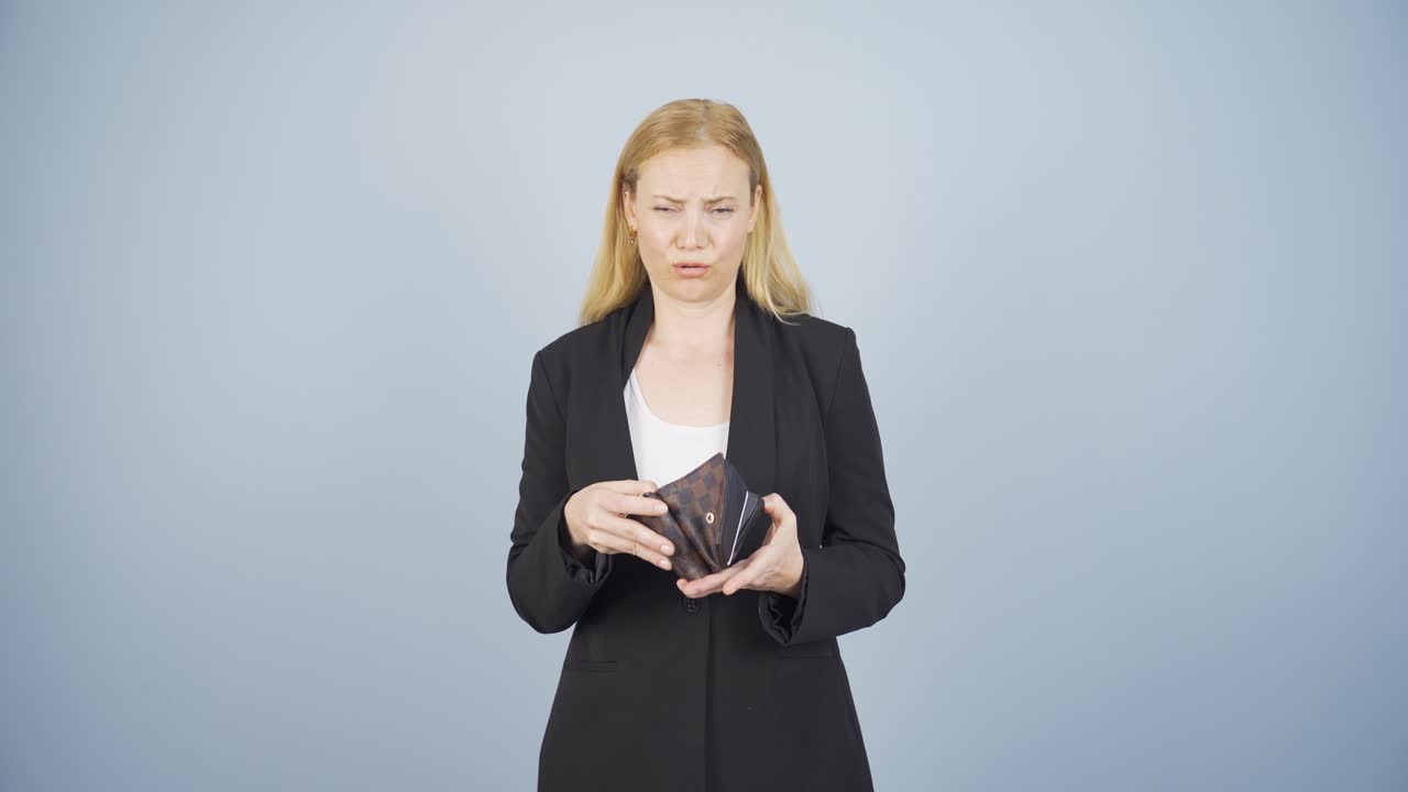 Premium stock video - Moneyless business woman. empty wallet.