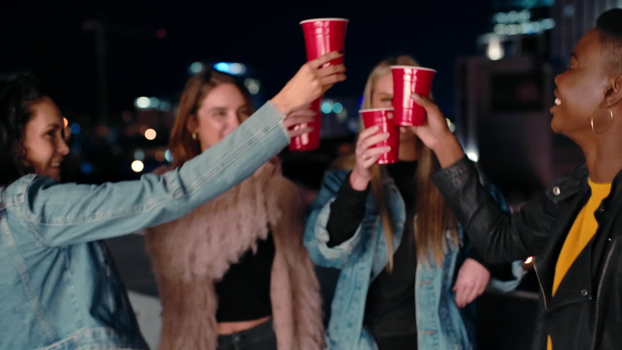 Premium stock video - Friends, cheers and party at night in the city