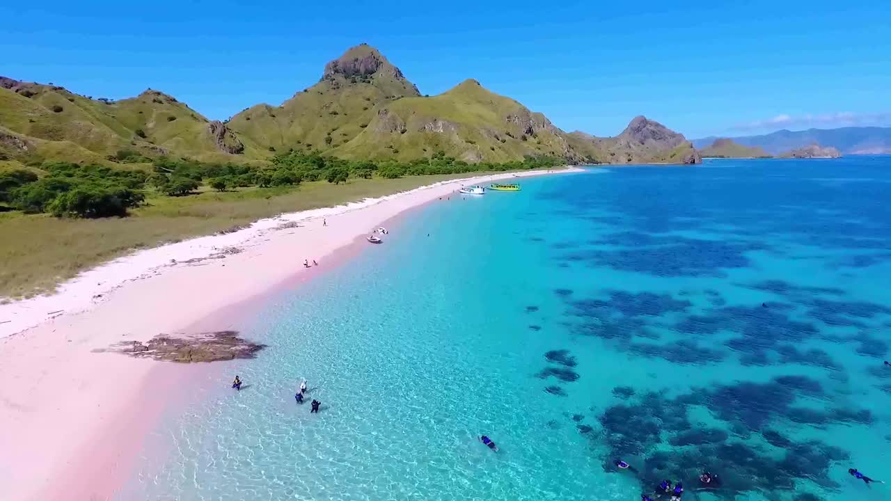 Aerial view of a small bay and hills on Pulau Padar island in between ...