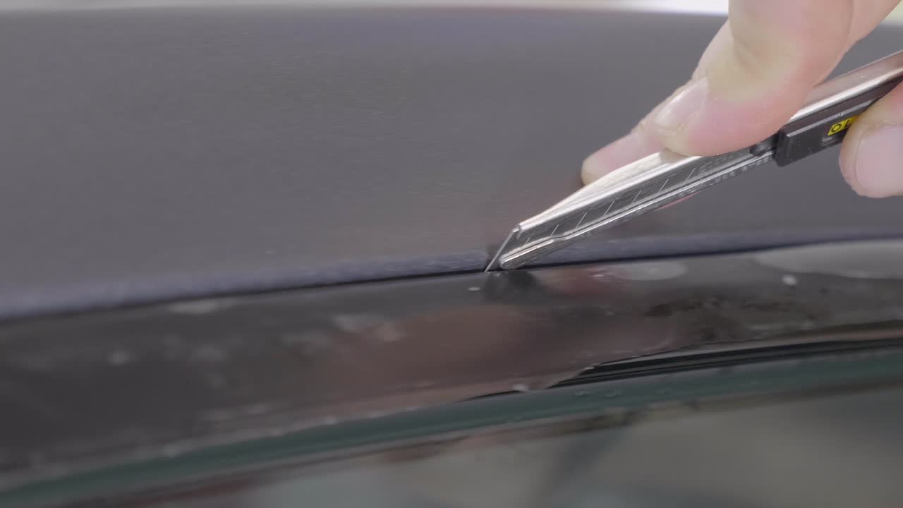 Close up hand using a sharp utility knife Premium Stock Video Footage