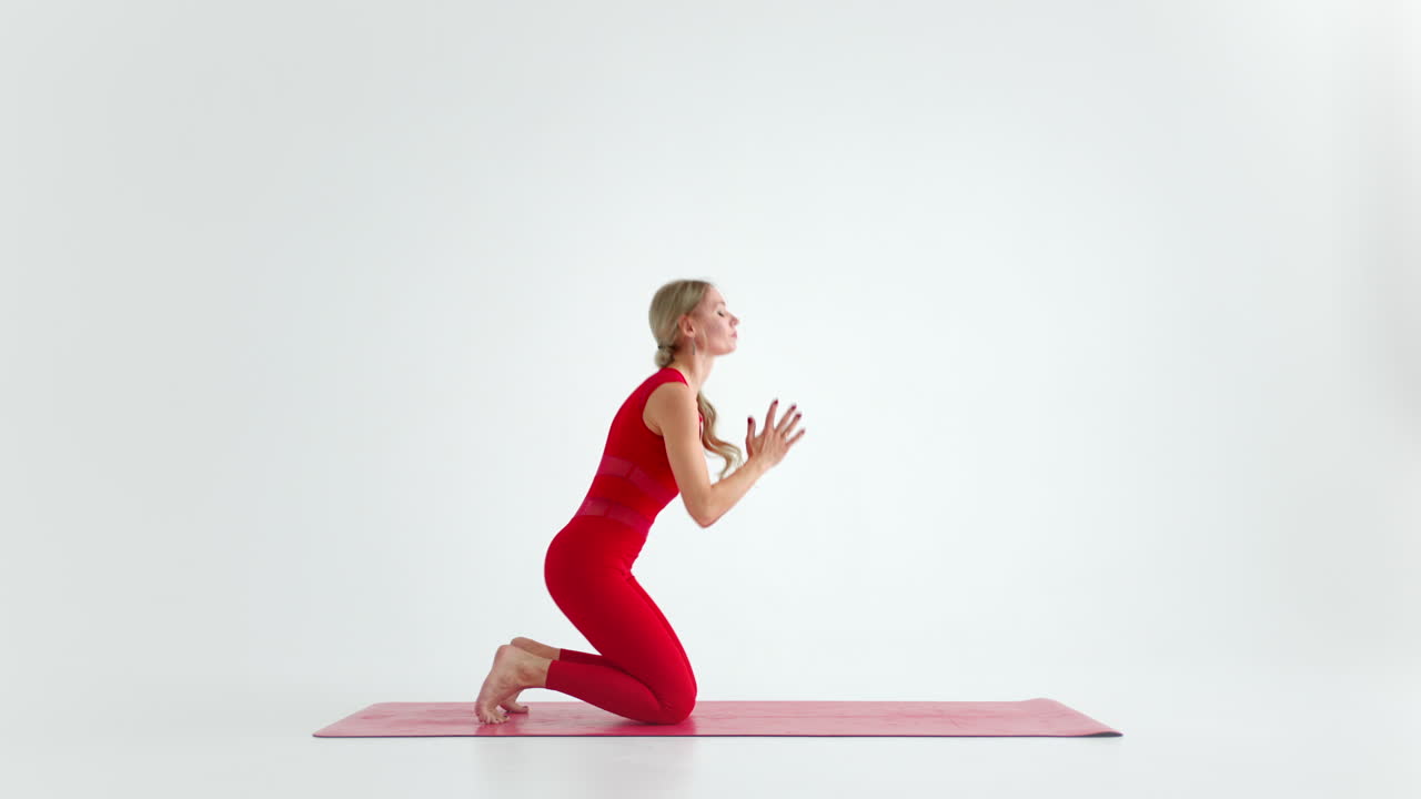 Premium stock video - Flexible young fit girl practice yoga or pilates ...