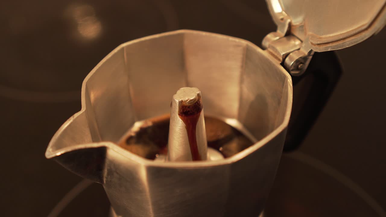 Premium stock video - Brewing espresso coffee in moka pot - first coffe ...