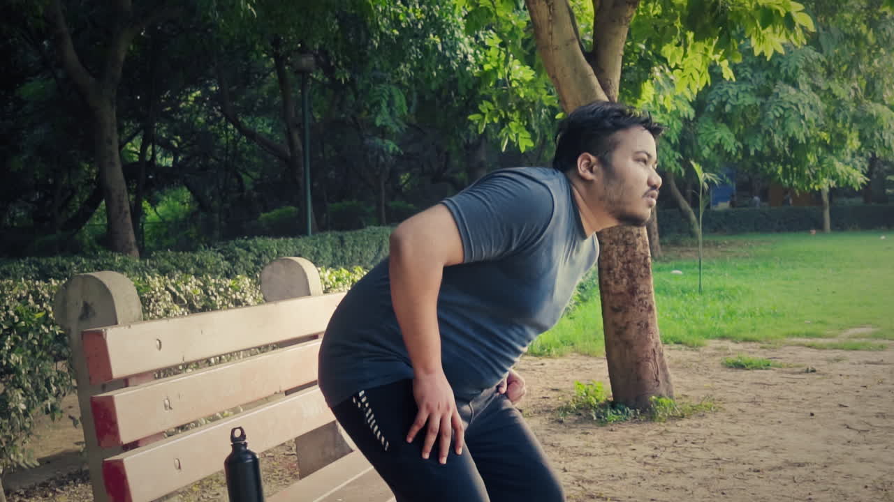 Premium stock video - Fat man suffering from backache during jogging at ...
