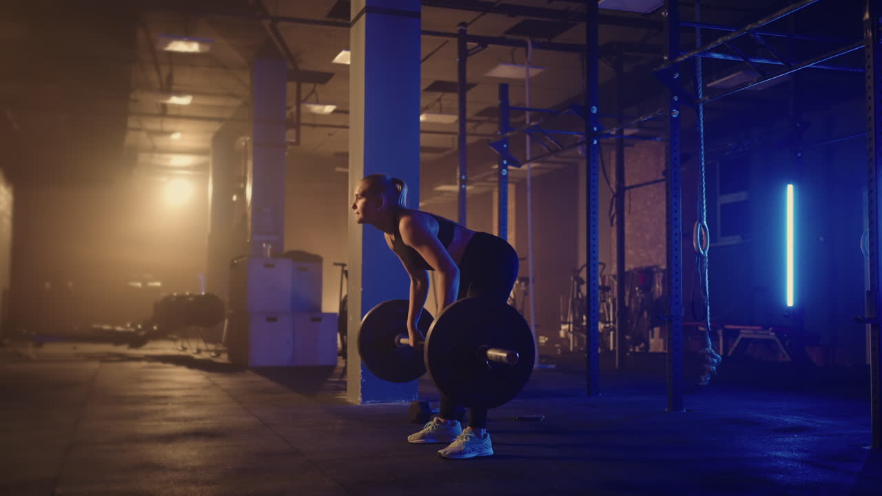 Athletic Beautiful Woman Does Overhead Deadlift With A Barbell In The ...