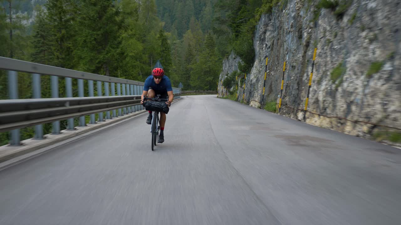 Premium stock video - Stabilized action shot of a cyclist in high speed ...