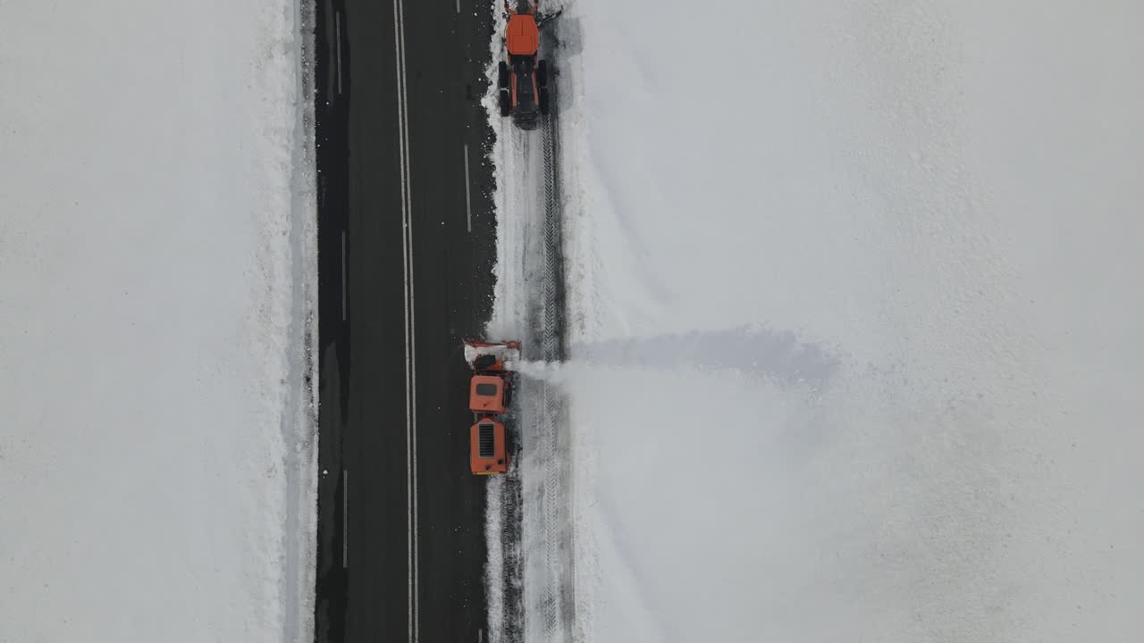 Premium stock video - Snow-fighting highways drone view