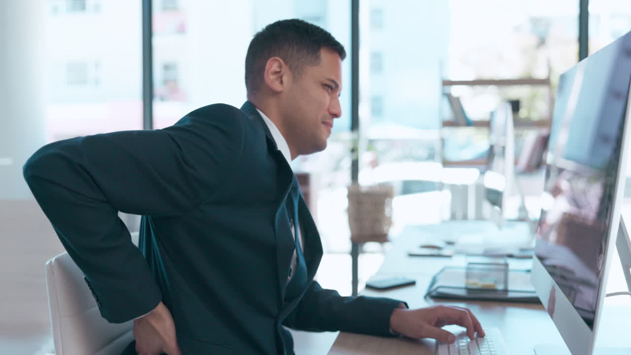 Premium stock video - Computer, back ache and posture with a business