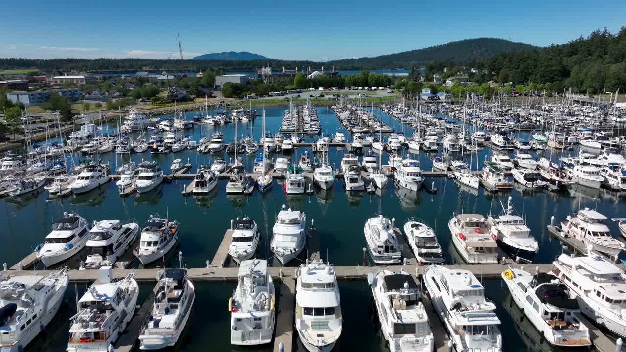 aerial view flying straight over many docked boats in a marina | freepik