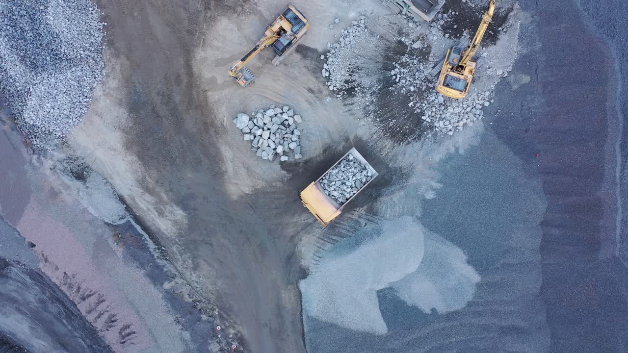Premium stock video - Drone shot of mining truck dumping rocks near ...