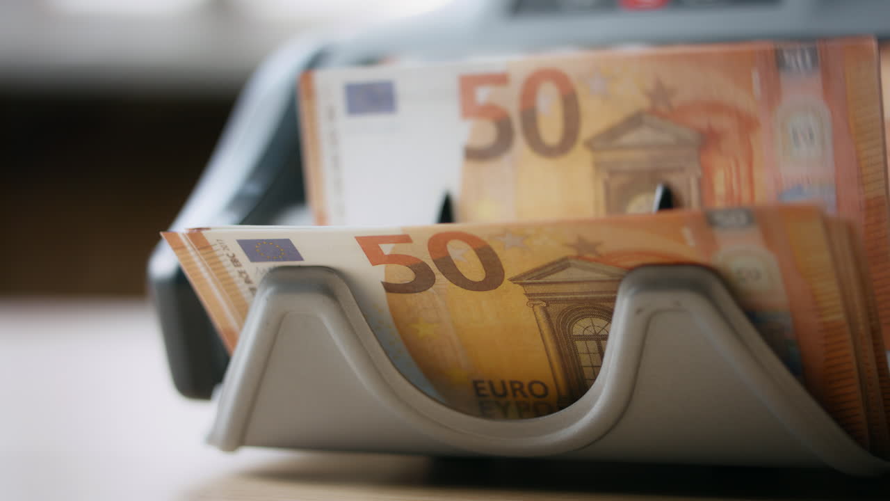 Automatic equipment counting euro bills close up. currency calculating ...