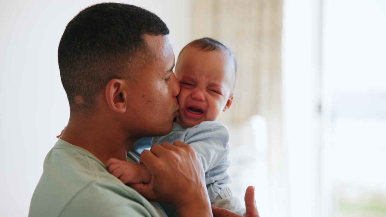Father, crying baby and comfort, kiss and care | Premium Stock Video ...