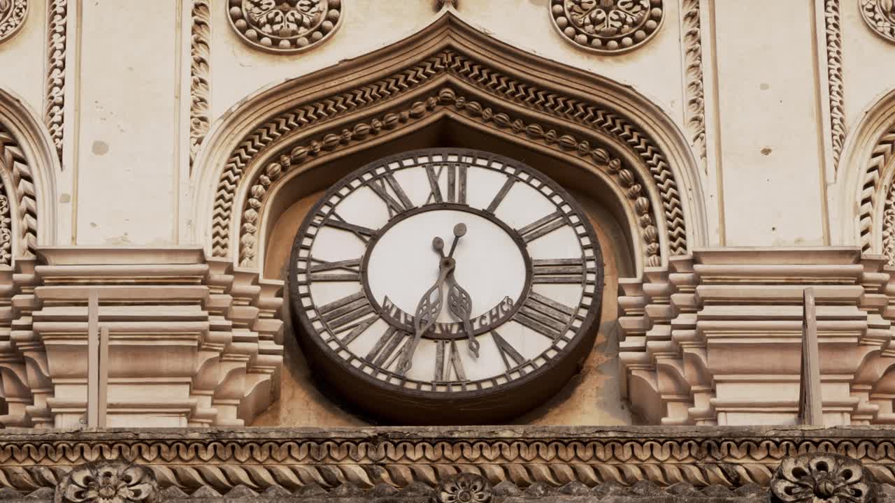 Close-up shot of the clock at historical Charminar and the ...