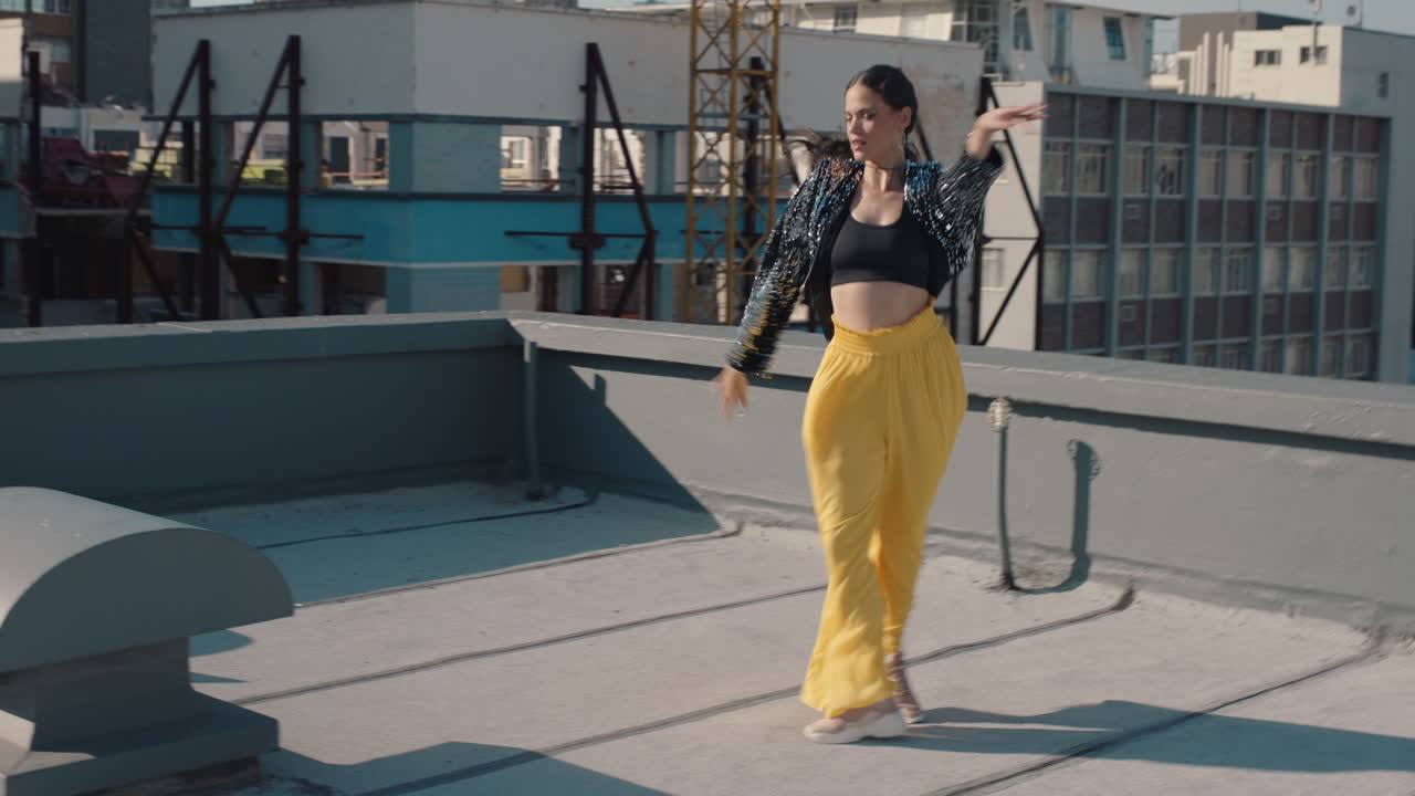 Premium stock video - Beautiful woman dancing on rooftop young ...