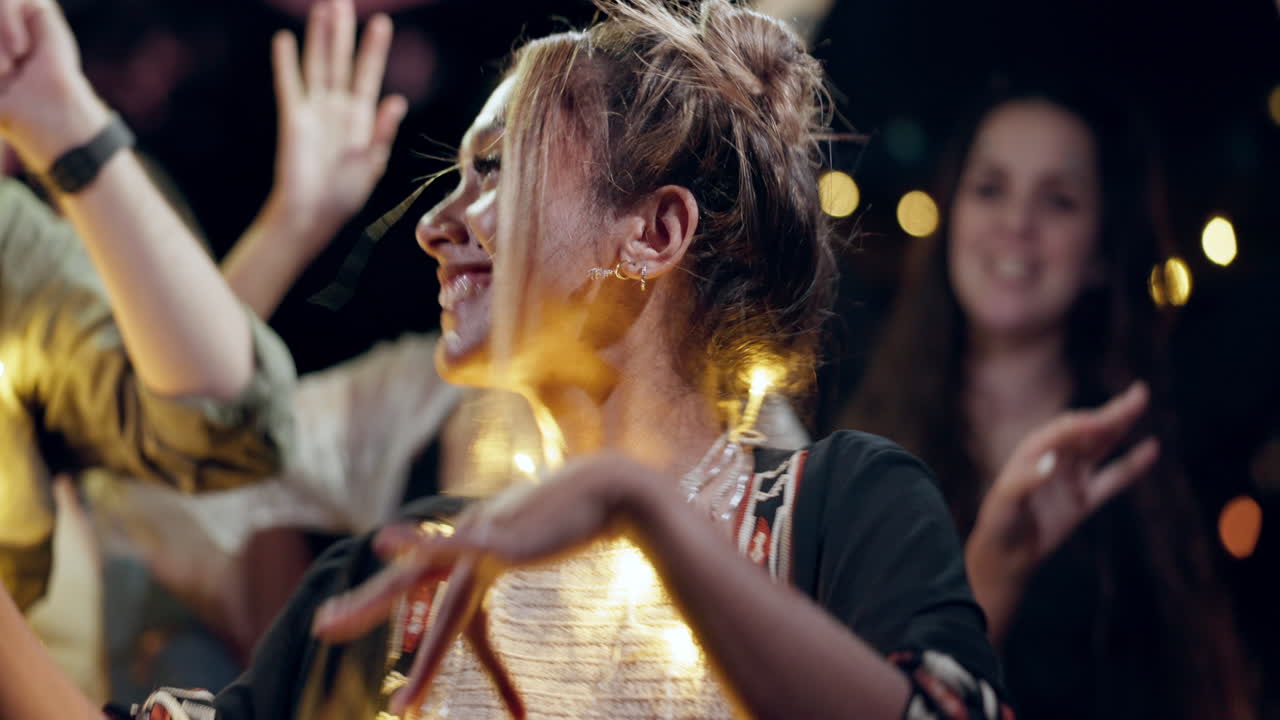 Premium stock video - Festival, night and outdoor dance with a woman