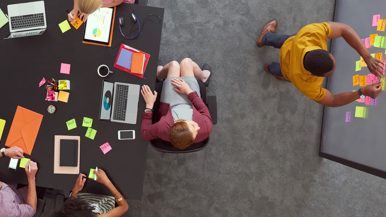 Premium stock video - Time lapse of designers working in a trendy office