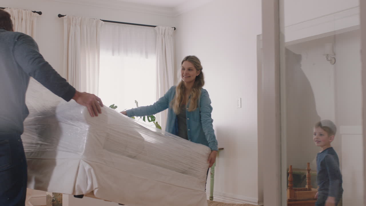 Premium stock video - Happy caucasian family moving into new home ...