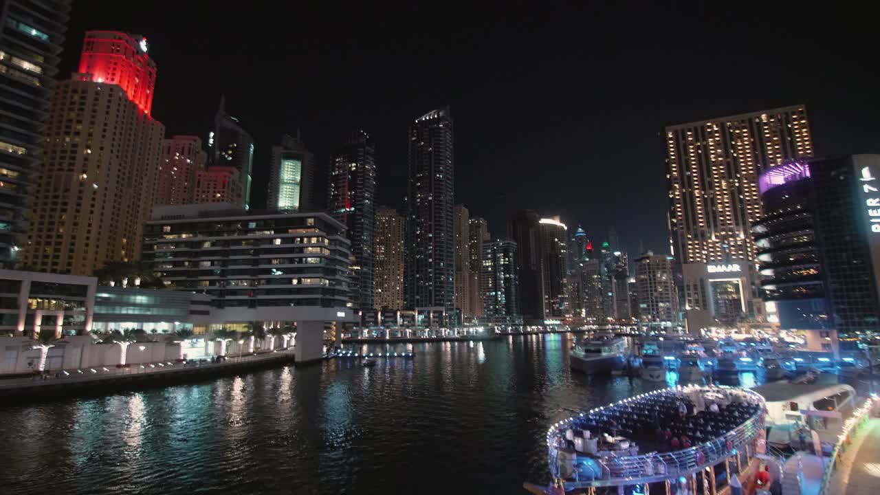 Premium stock video - Night city view over canal with skyscrapers