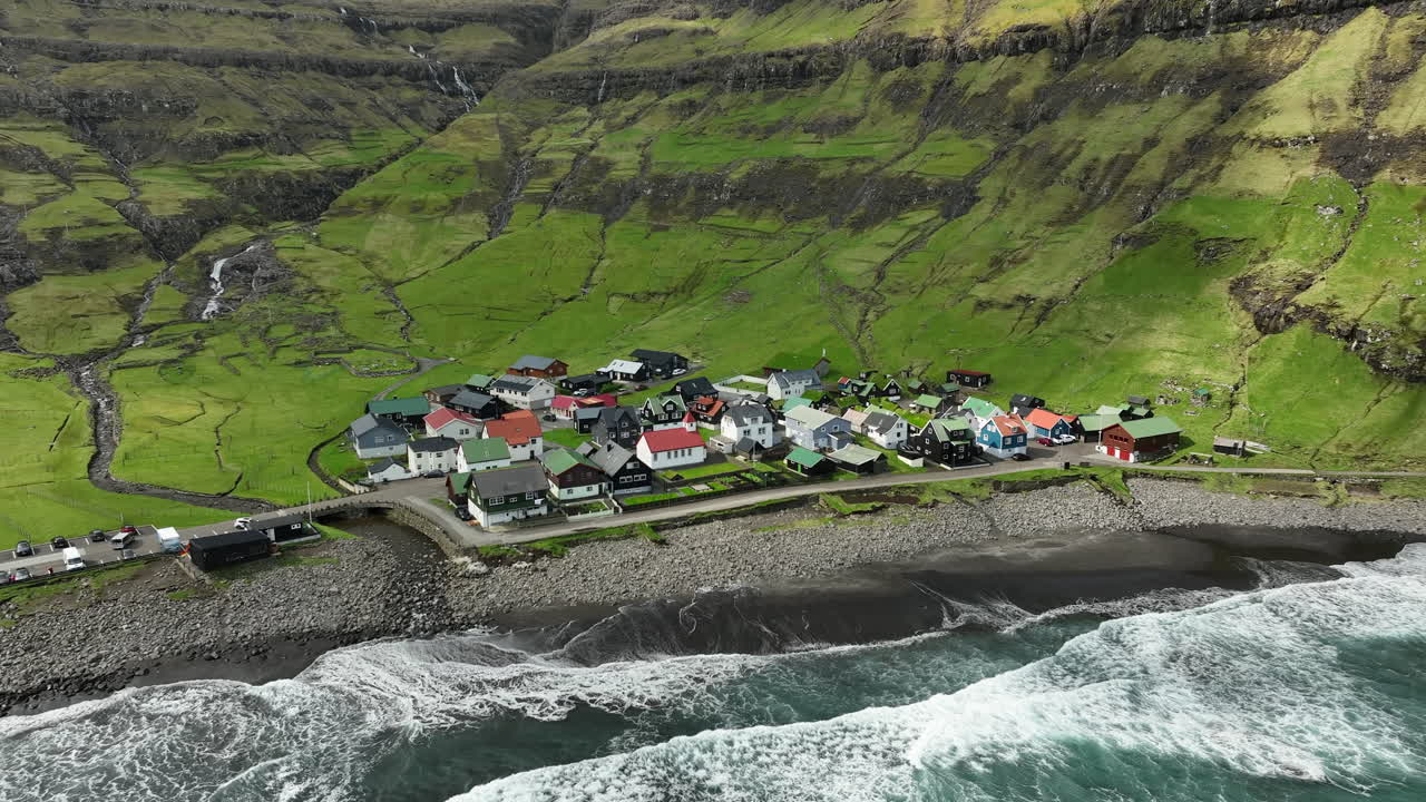 Tjørnuvík village, faroe islands: aerial view traveling in towards the ...