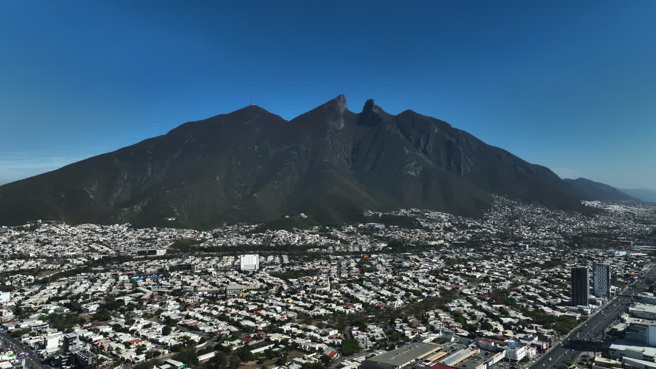 Aerial view over the monterrey cityscape with the cerro de la silla ...