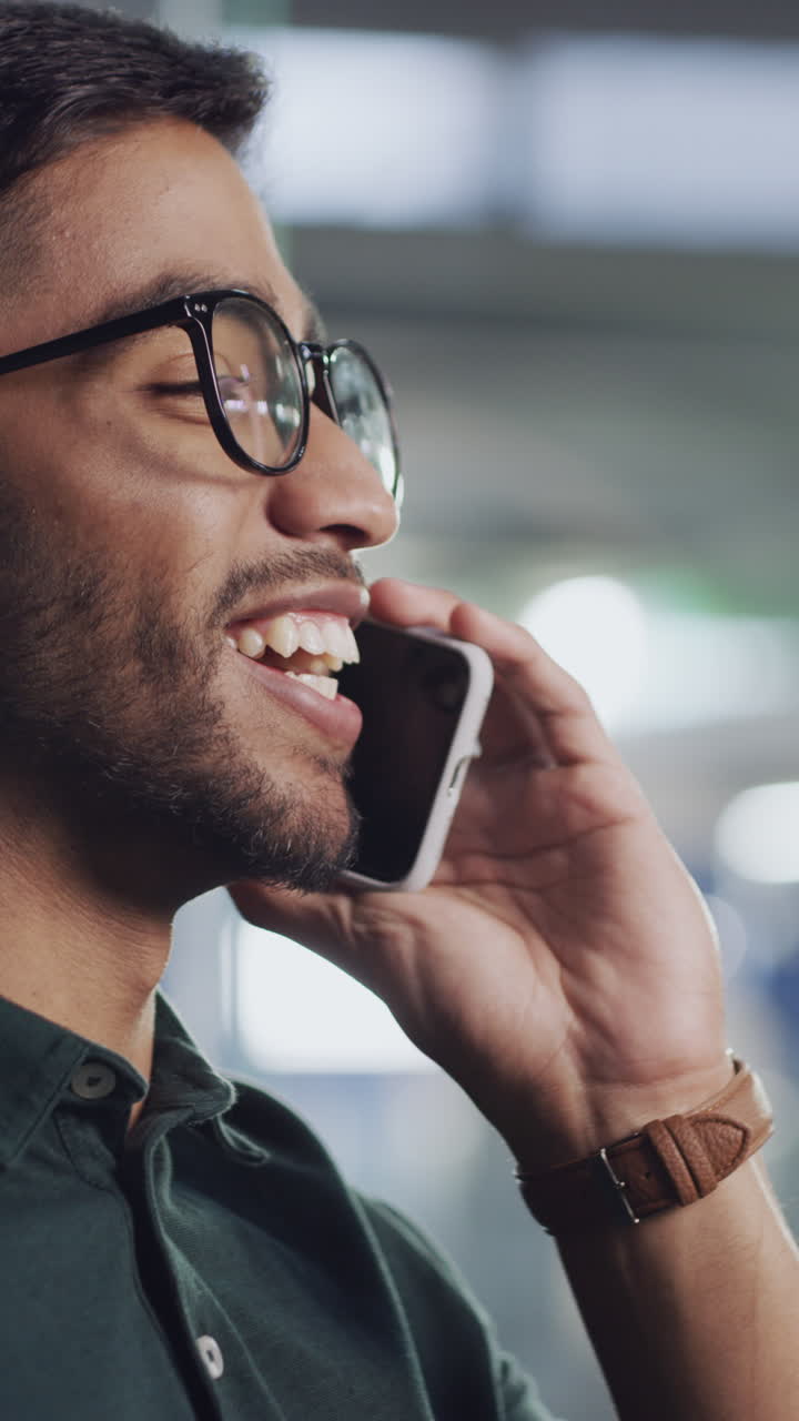 Young Man Talking and Laughing on a Smartphone Call | Premium Stock ...