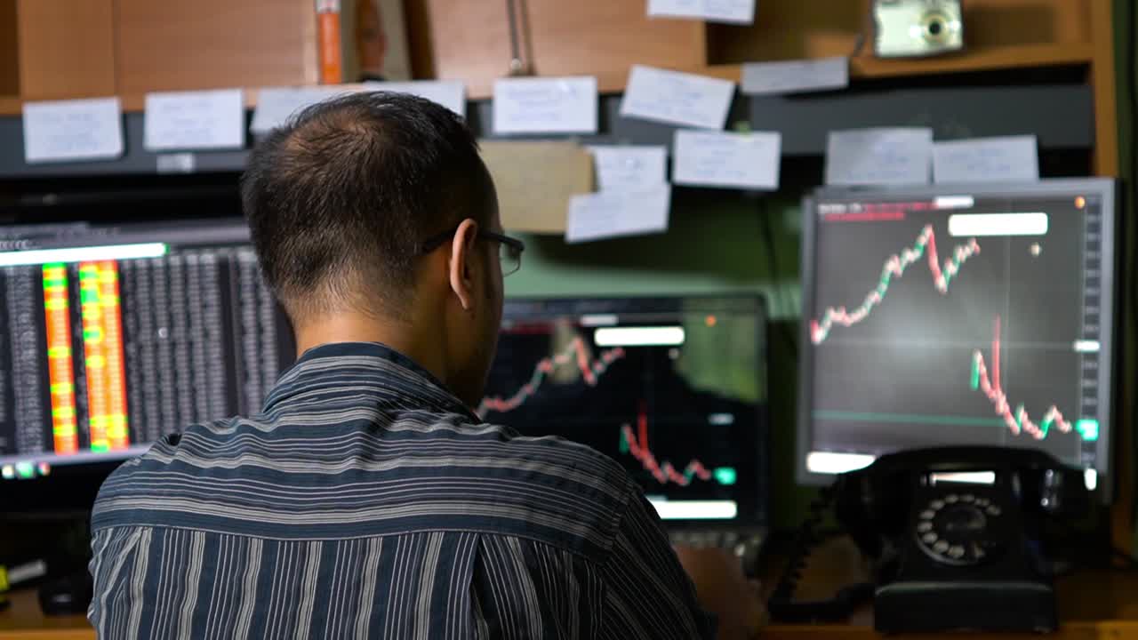 Premium stock video - Stock market broker watching stocks