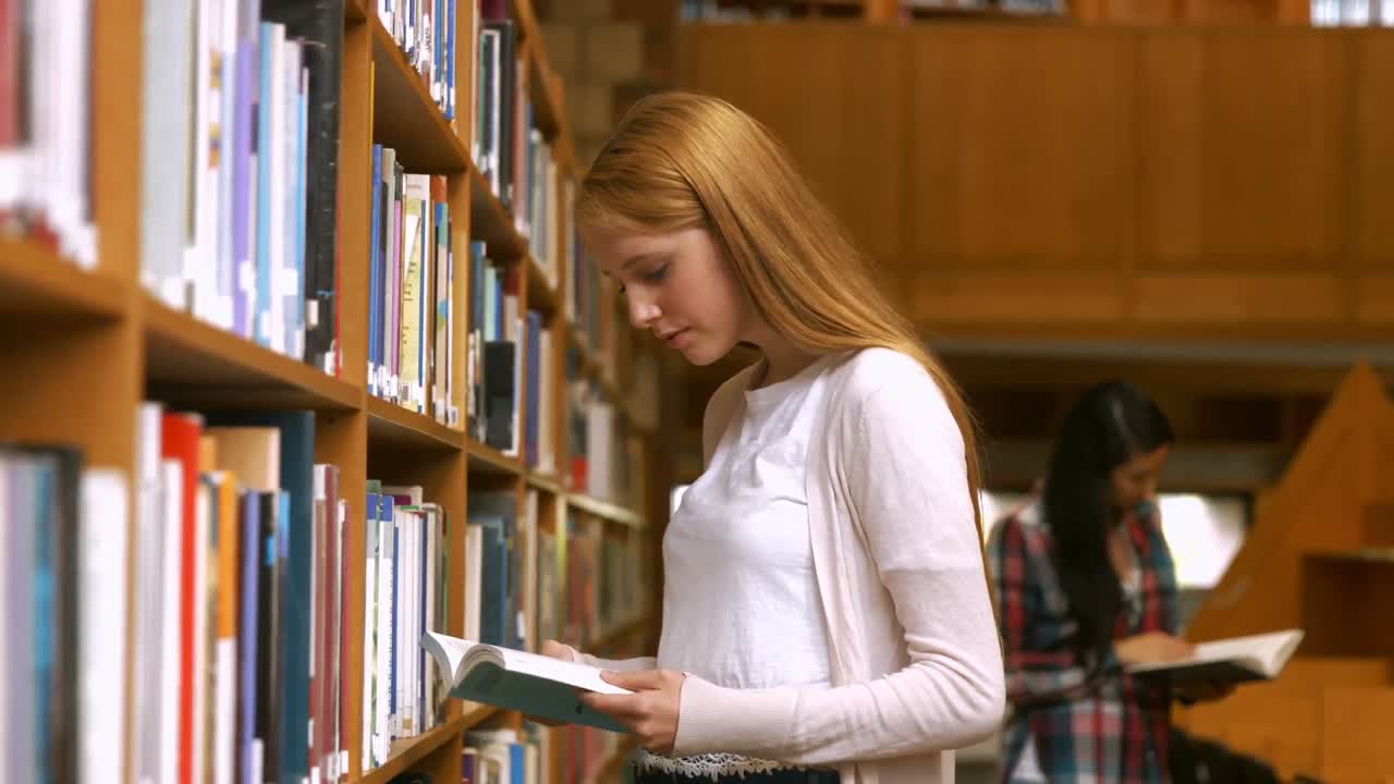 Students reading in a library Premium Stock Video Footage