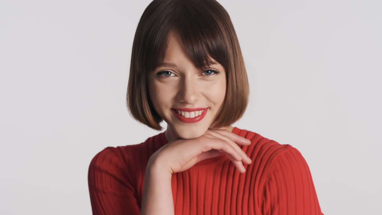 Free stock video - Smiling girl in red sweater