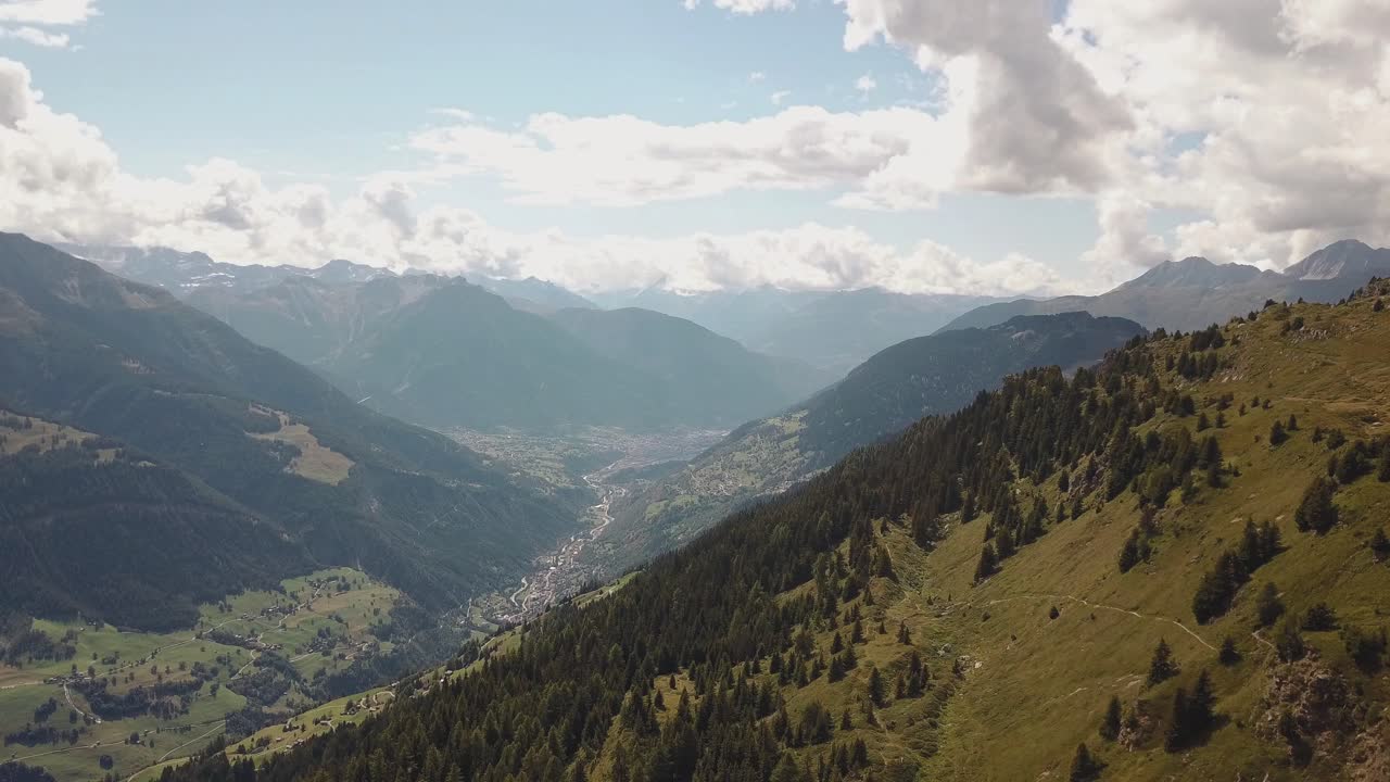 Premium stock video - Drone shot slow fly over a mountain looking over ...