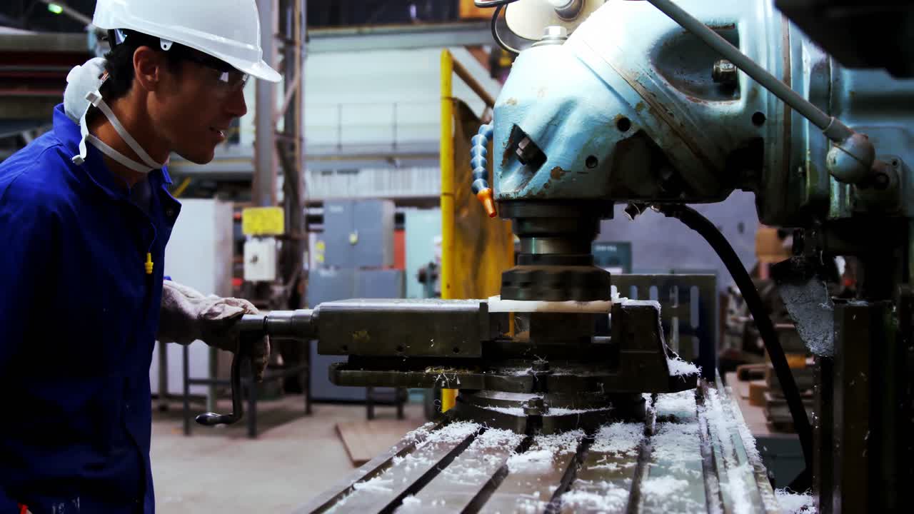 Premium stock video - Male engineer working on a machine 4k