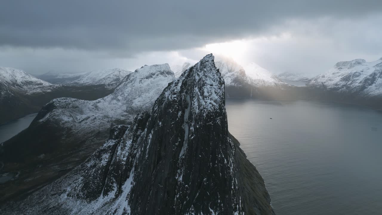 Sunrays piercing clouds over Segla mountain, Senja Island, Norway ...