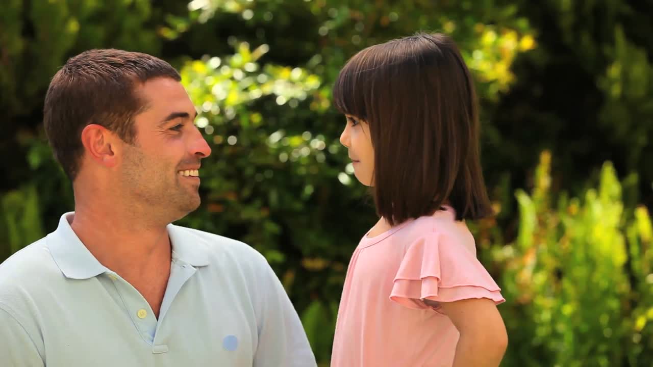 Premium stock video - Little girl talking with her father