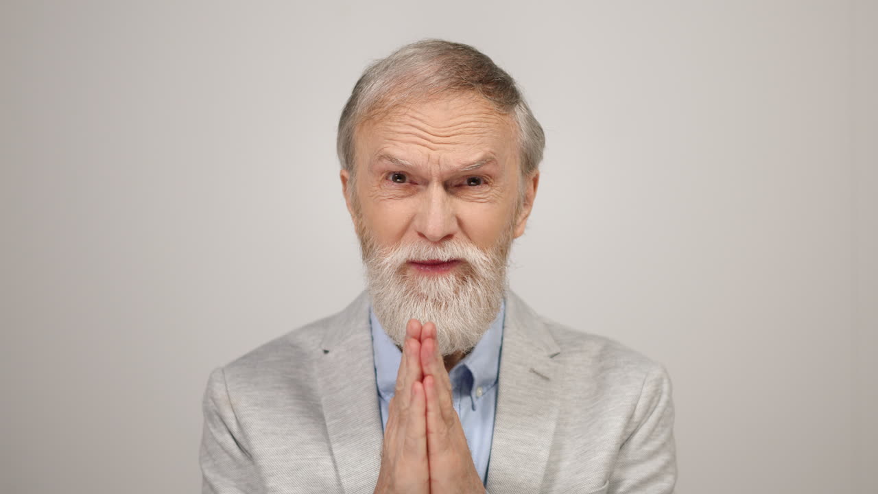Worried Man Asking For Help In Studio. Old Guy Putting Hands For Pray ...